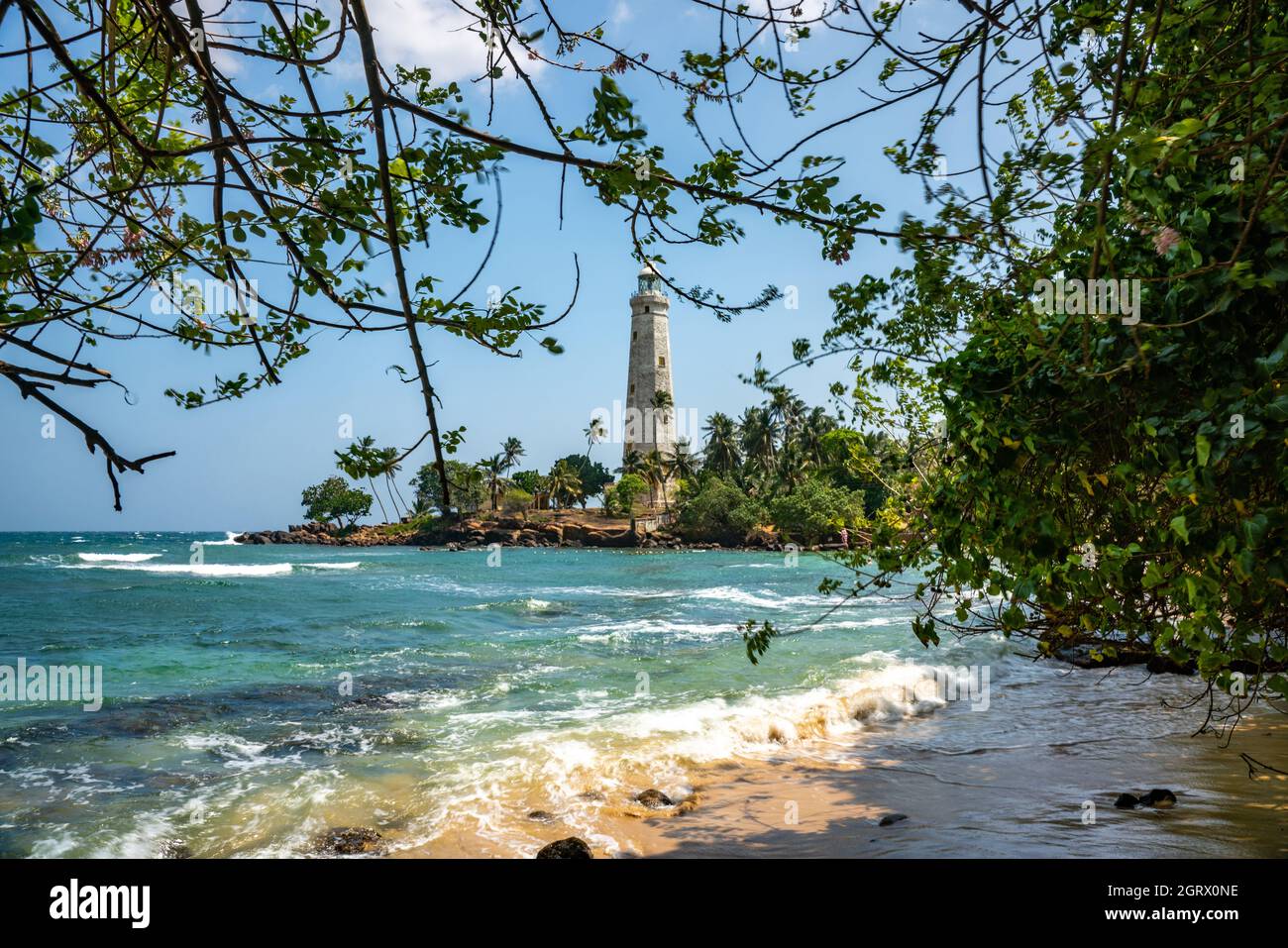 Beautiful beach and White lighthouse Dondra in Sri Lanka. View from the ...
