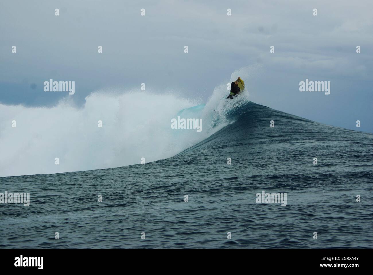 Surfing Dangerous Waves Stock Photo - Alamy