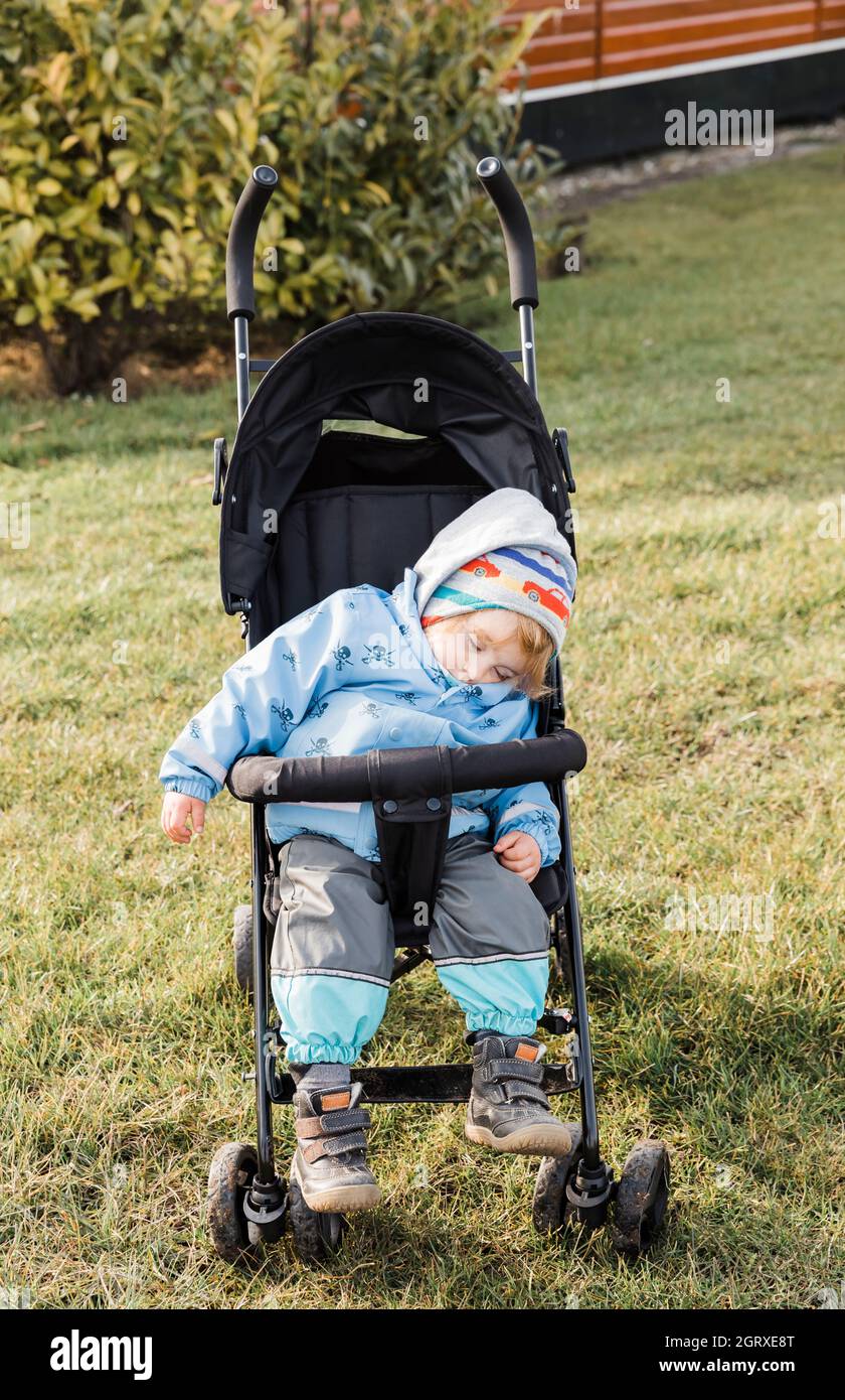 Baby sleeping on stroller in hi-res stock photography and images - Alamy