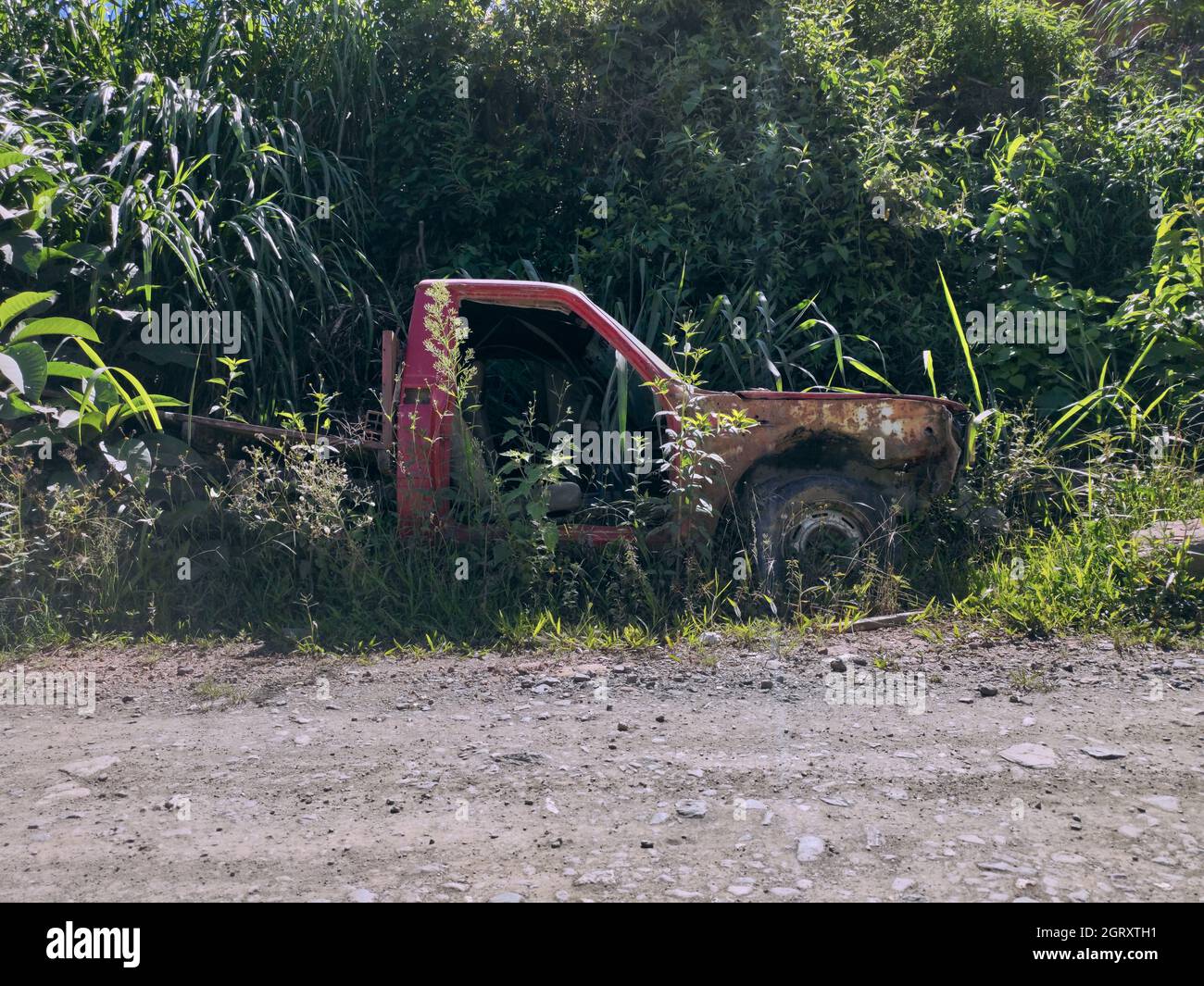 Abandoned broken car on the side of the road Stock Photo - Alamy