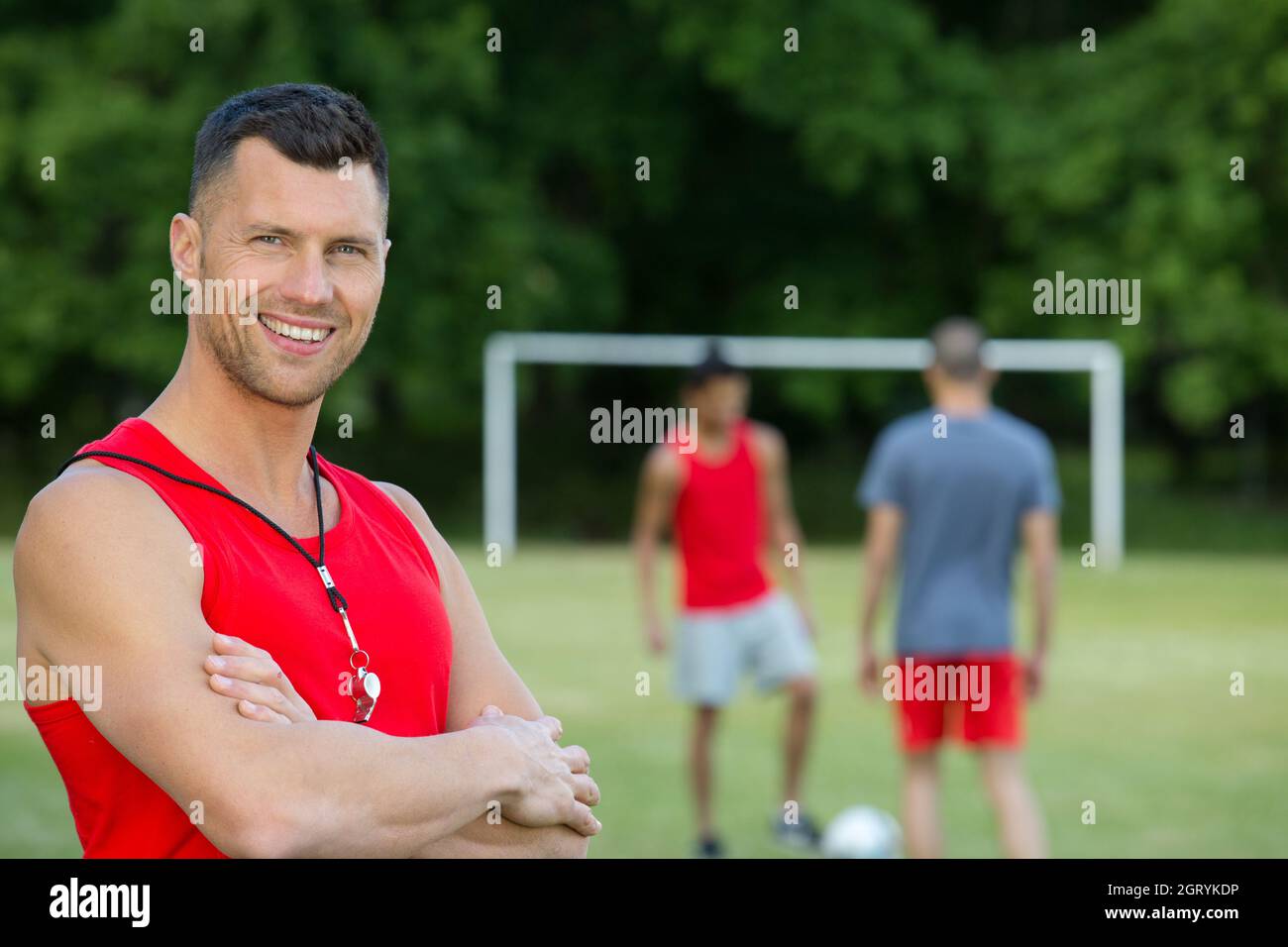 portrait of male football team coach Stock Photo - Alamy