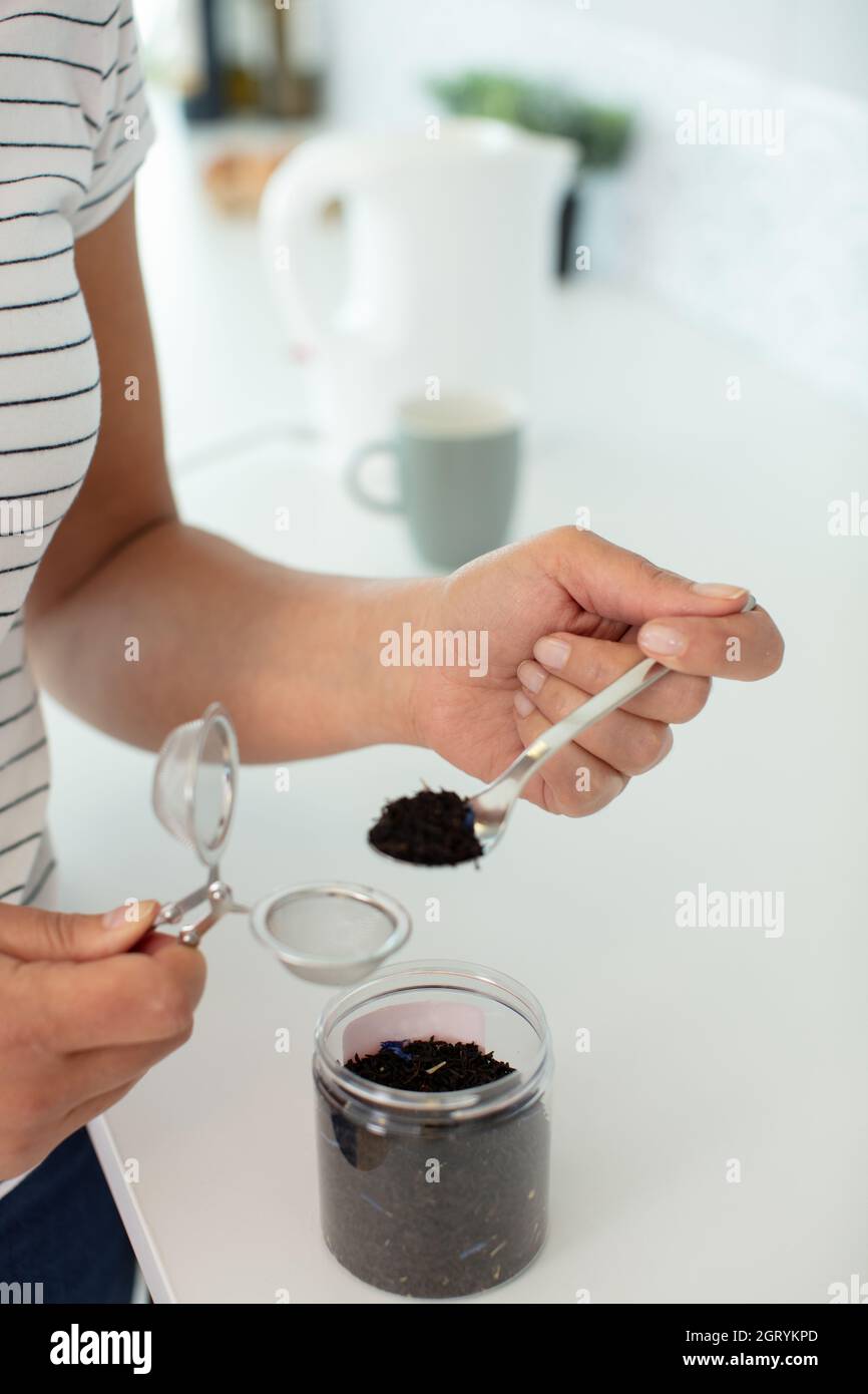 close up of a woman preparing tea Stock Photo - Alamy