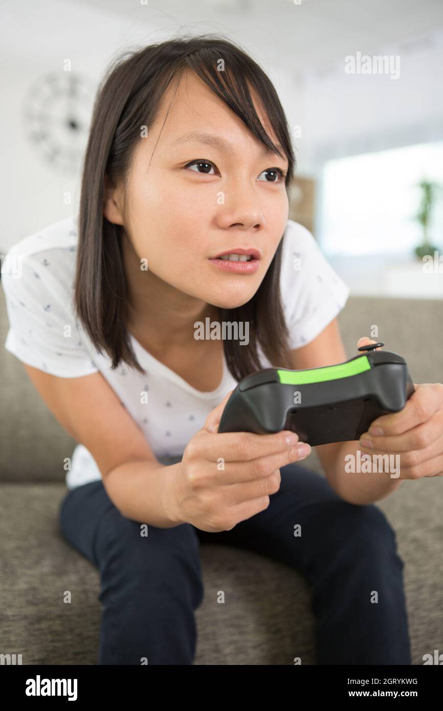 a woman playing video games Stock Photo - Alamy