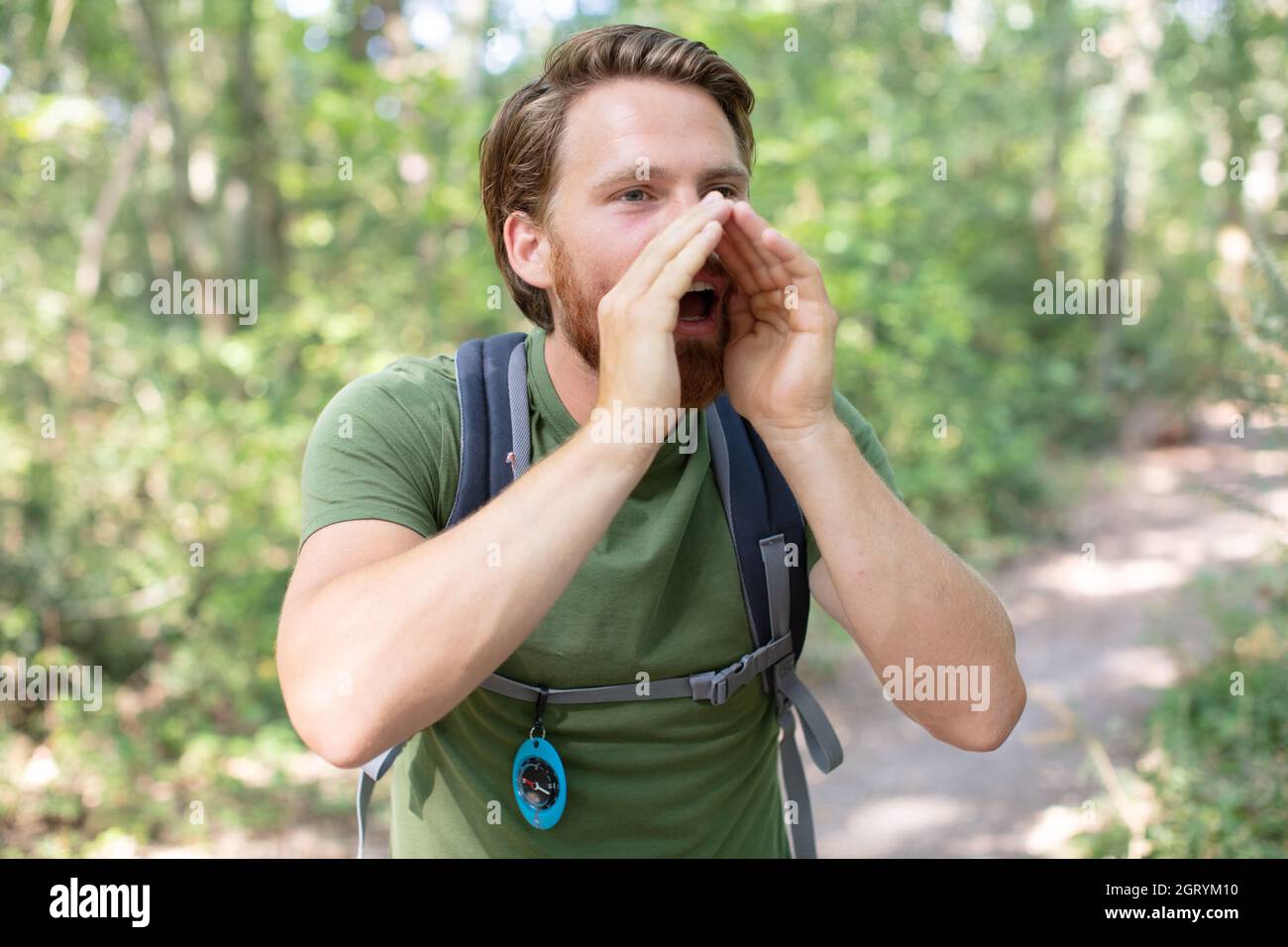 successful hiker shouting hiking on mountain peak edge Stock Photo - Alamy