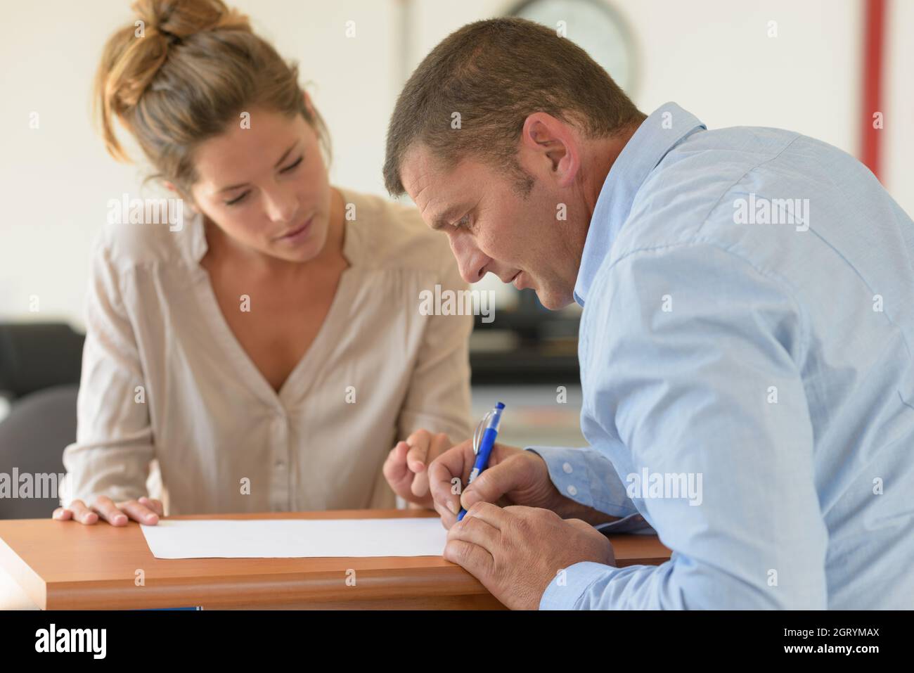 customer writing his product preference Stock Photo - Alamy