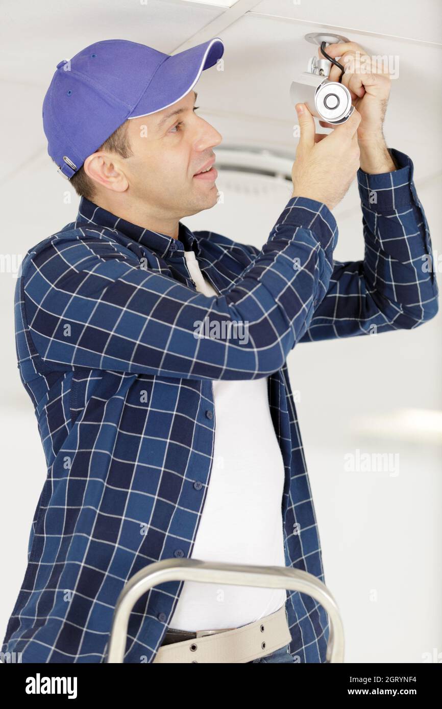 a professional cctv technician working Stock Photo - Alamy