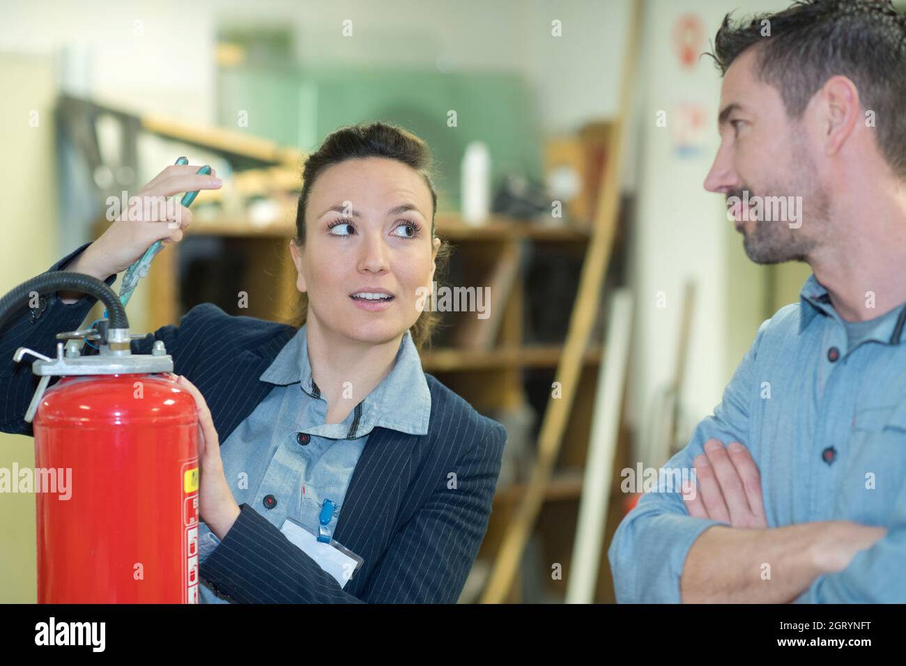 portrait of people during fire extinguisher training Stock Photo - Alamy