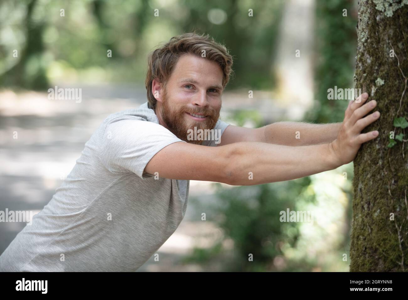 Man leaning against tree hi-res stock photography and images - Alamy