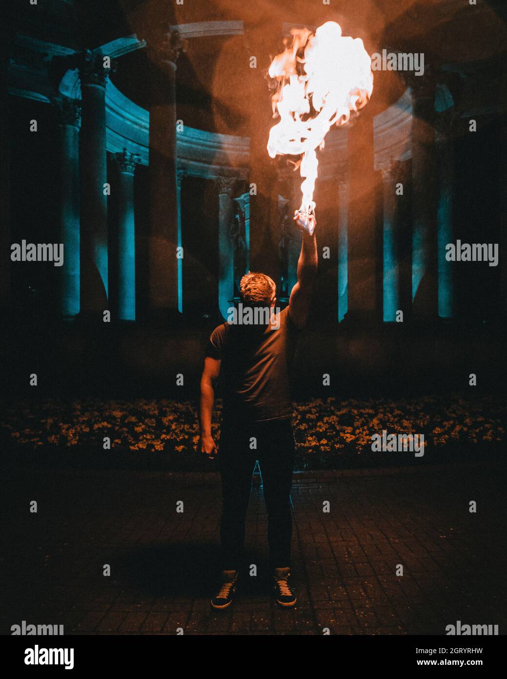 Burning fire standing hand raised hi-res stock photography and images ...