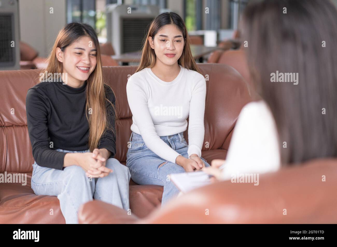 Female Southeast Asian psychologist doctor consults in a psychotherapy ...
