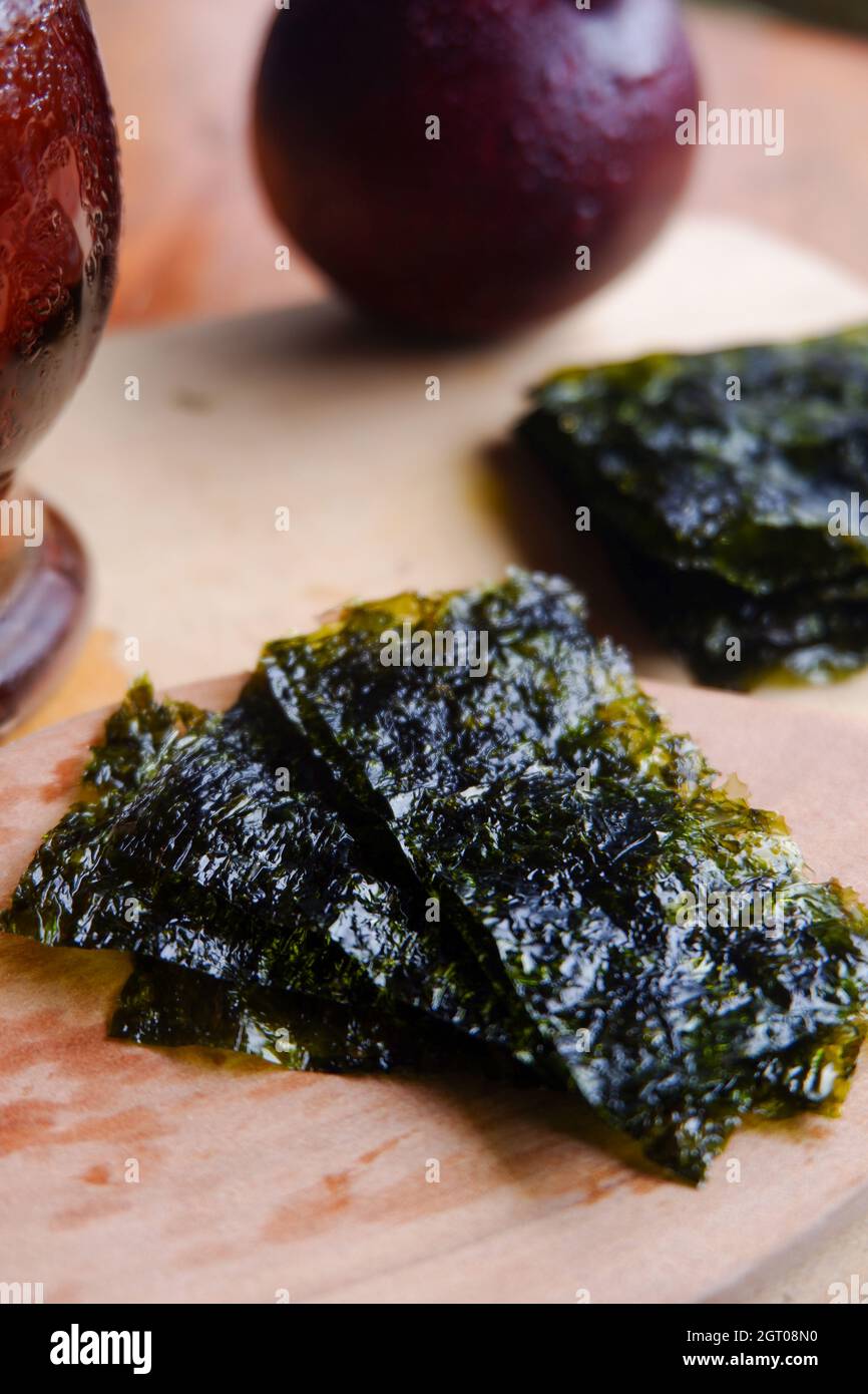 Vertical shot of chopped seaweed and mangosteen on a wooden board Stock ...