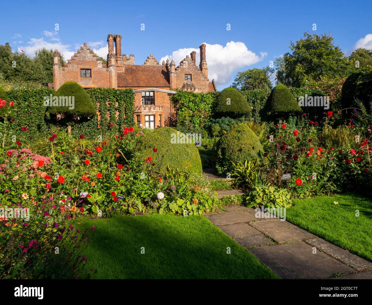Chenies Manor house in Autumn seen from the Sunken garden with many ...
