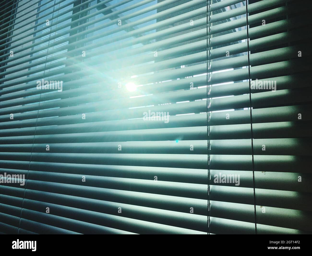 Sunlight streaming through blinds hi-res stock photography and images ...