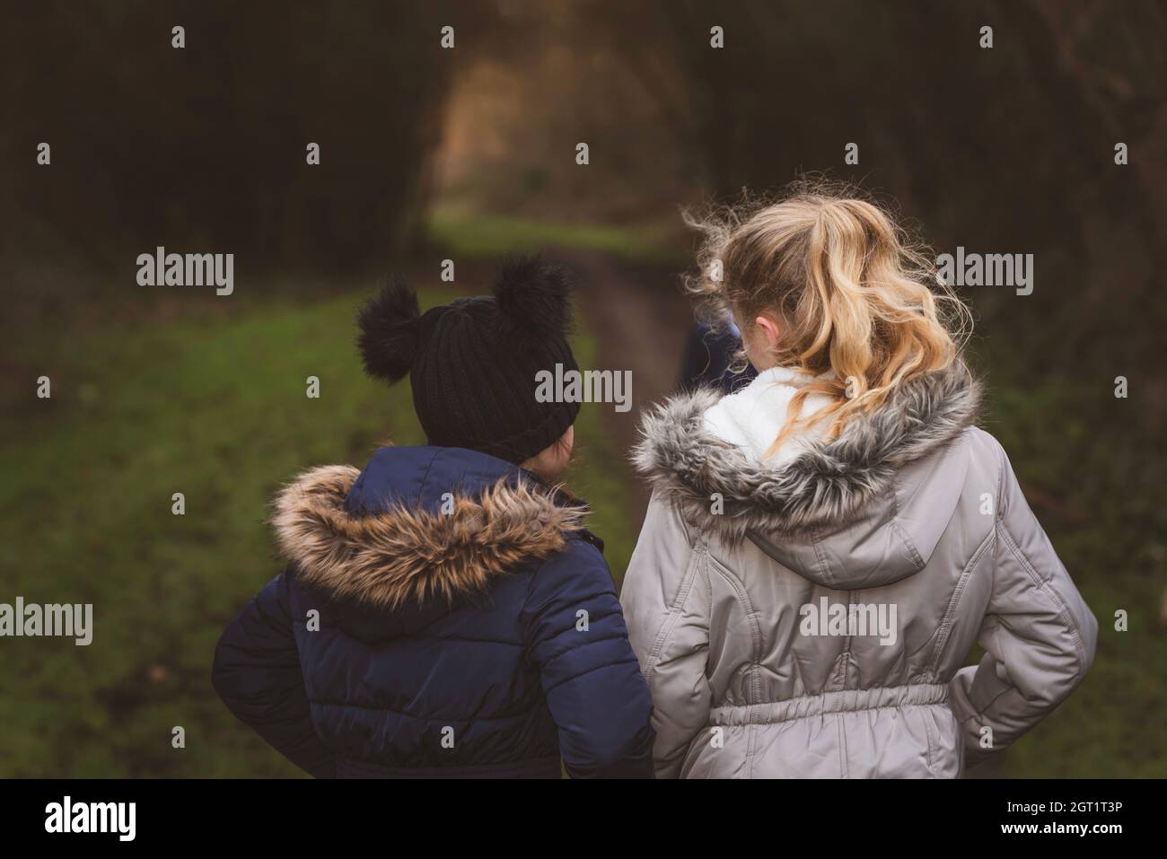 Rear View Of 2 Children Walking Outdoors Stock Photo - Alamy