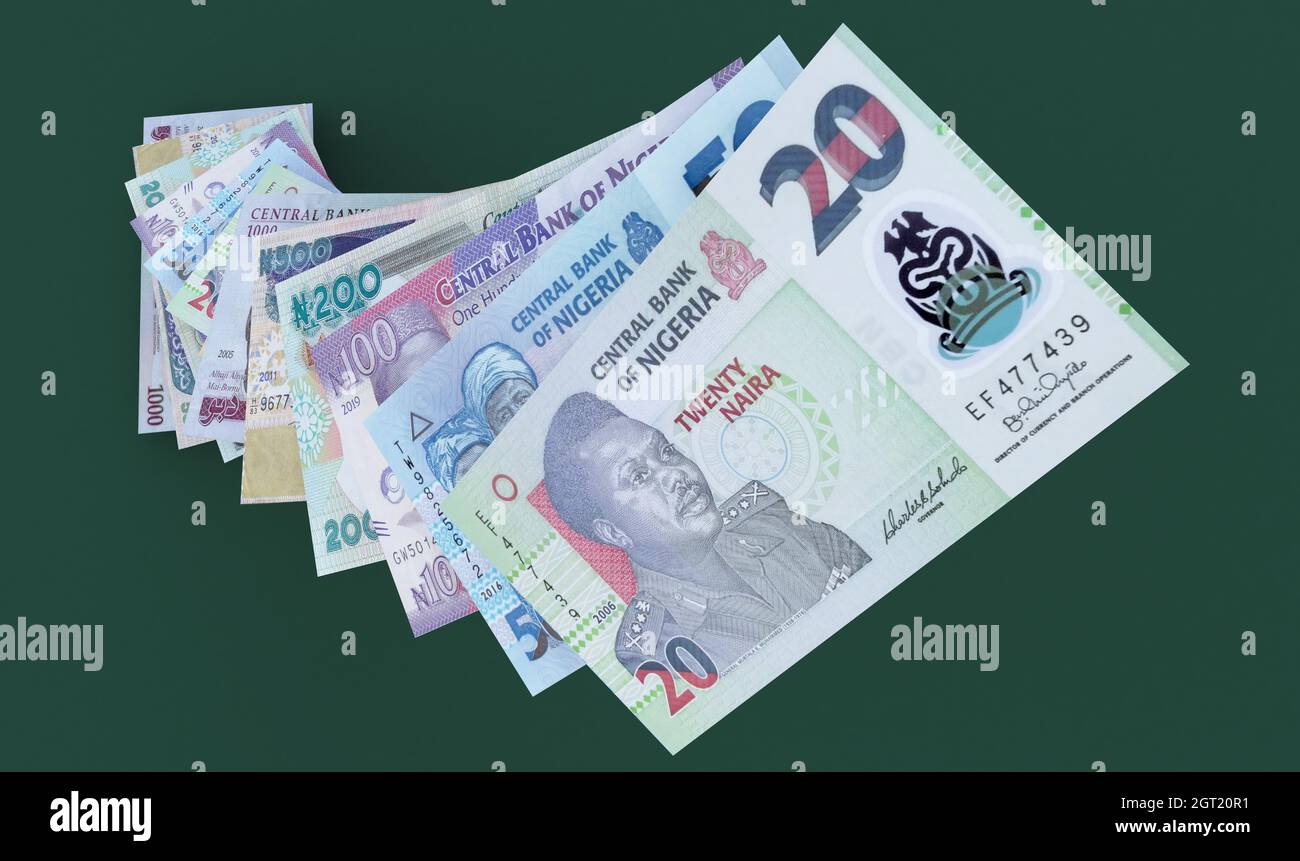 All denominations of Nigerian naira note on green plain background ...