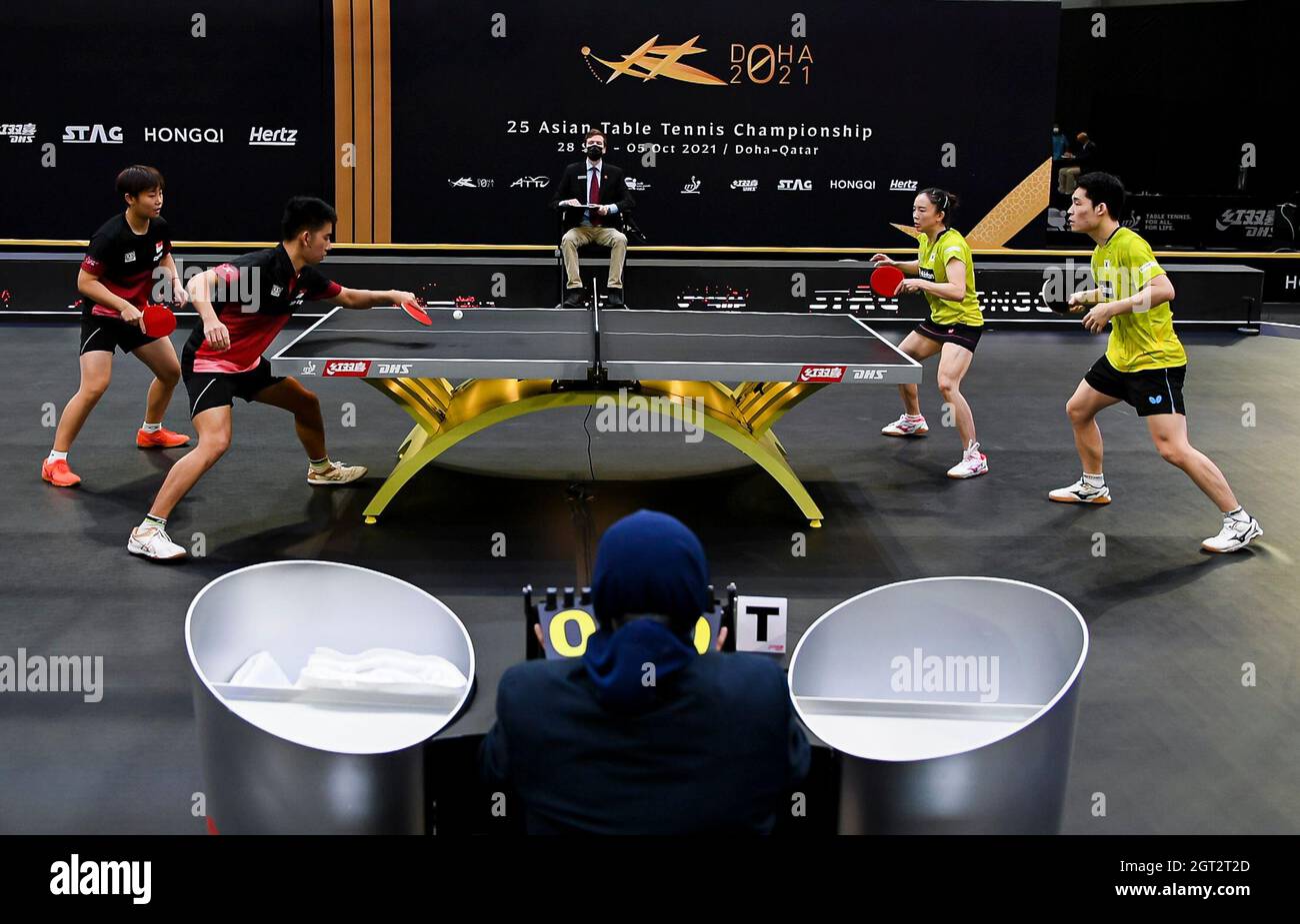 Doha, Qatar. 1st Oct, 2021. Jang Woojin (1st R) and Jeon Jihee (2nd R ...