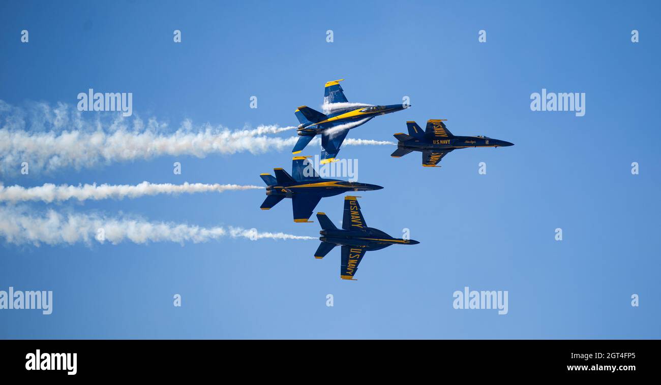 The U.S. Navy Blue Angels break out of formation during their ...