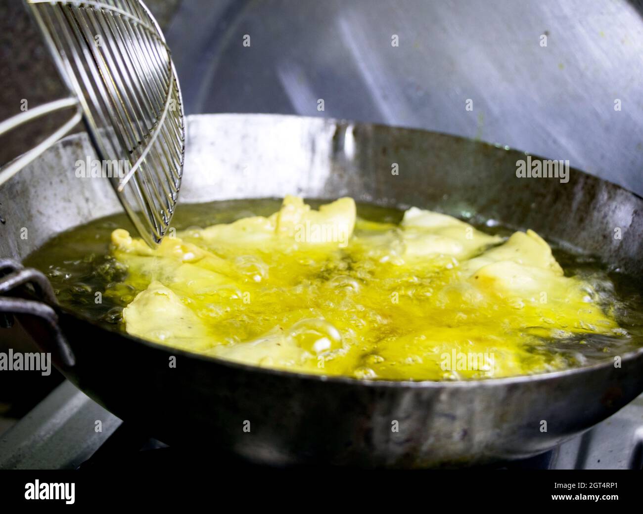 Frying samosas hi-res stock photography and images - Alamy