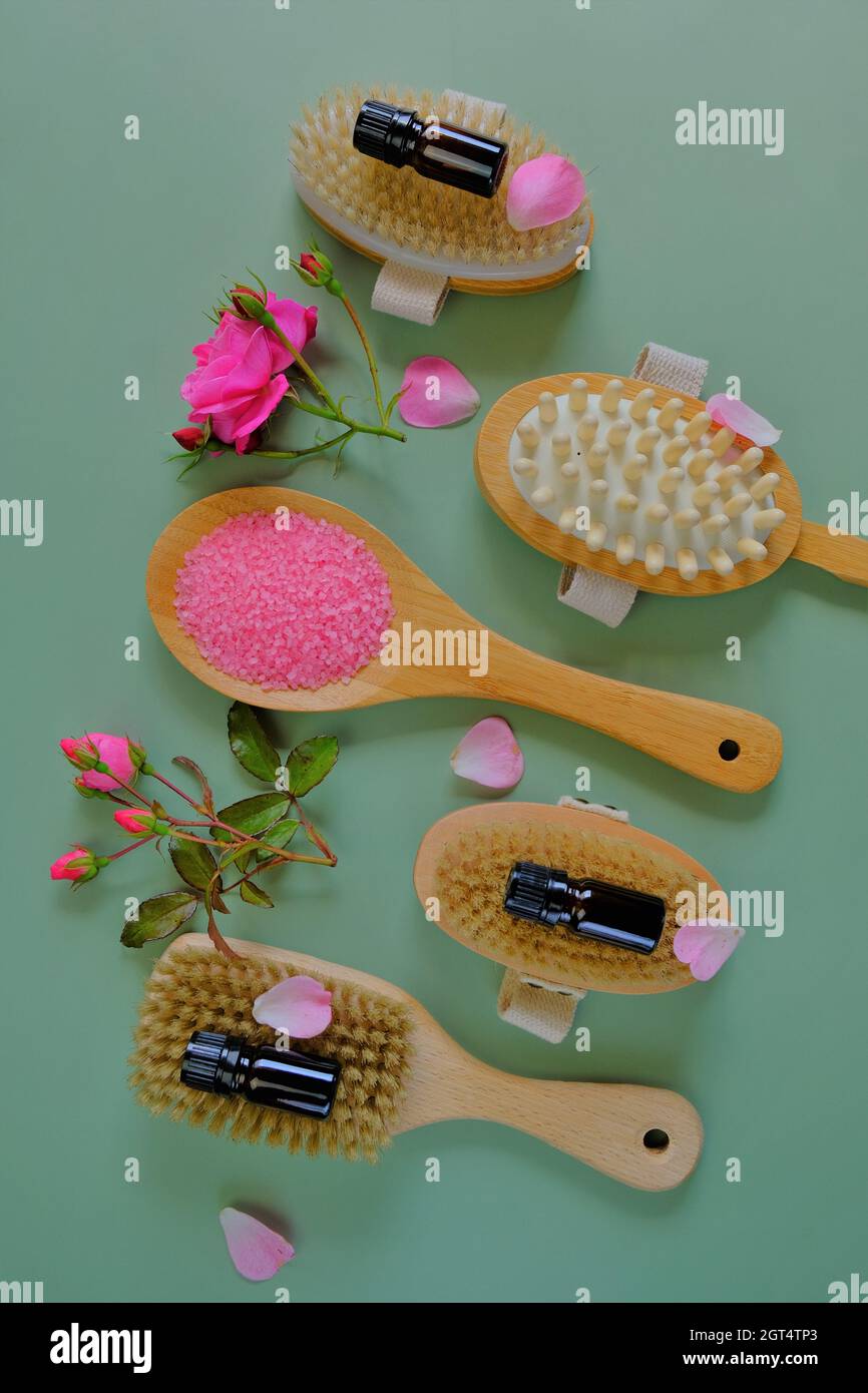 Rose oil. Spa, massage and aromatherapy. Massage brushes set, oil in ...