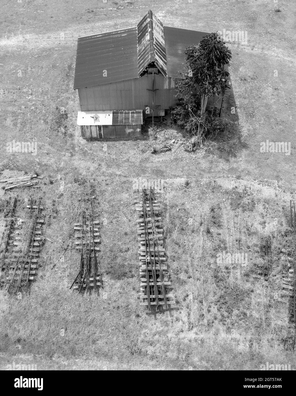 High drone aerial of historical maintenance sugar mill shed landscape ...