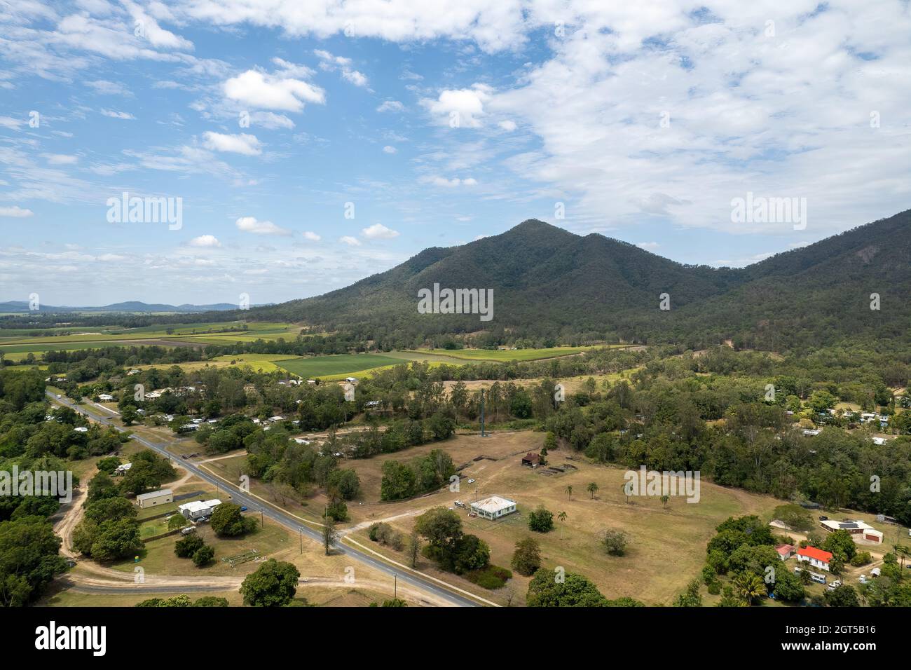 High drone aerial of small Australian country town in a valley with ...