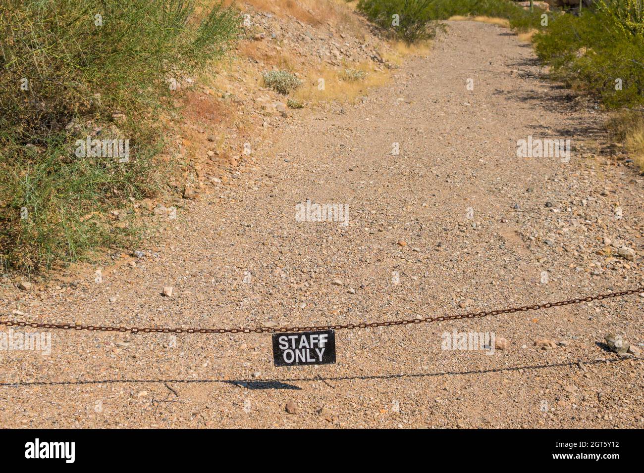 Staff Only sign hangs from a metal chain outdoors Stock Photo - Alamy