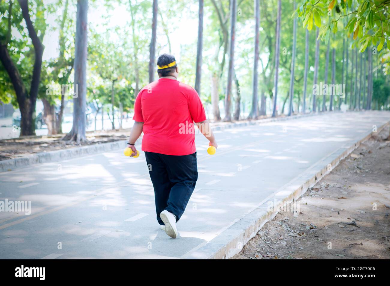 Overweight man walking hi-res stock photography and images - Alamy