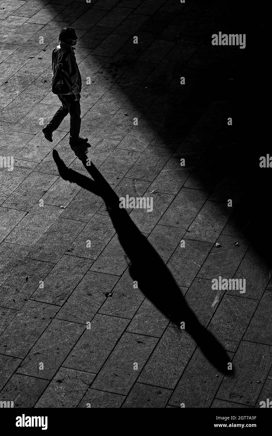 Silhouette men standing on street Black and White Stock Photos & Images ...
