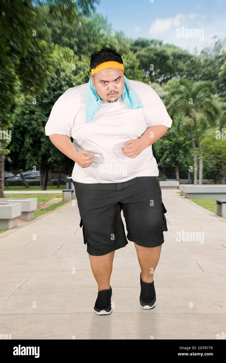 Indian man running in park hi-res stock photography and images - Alamy
