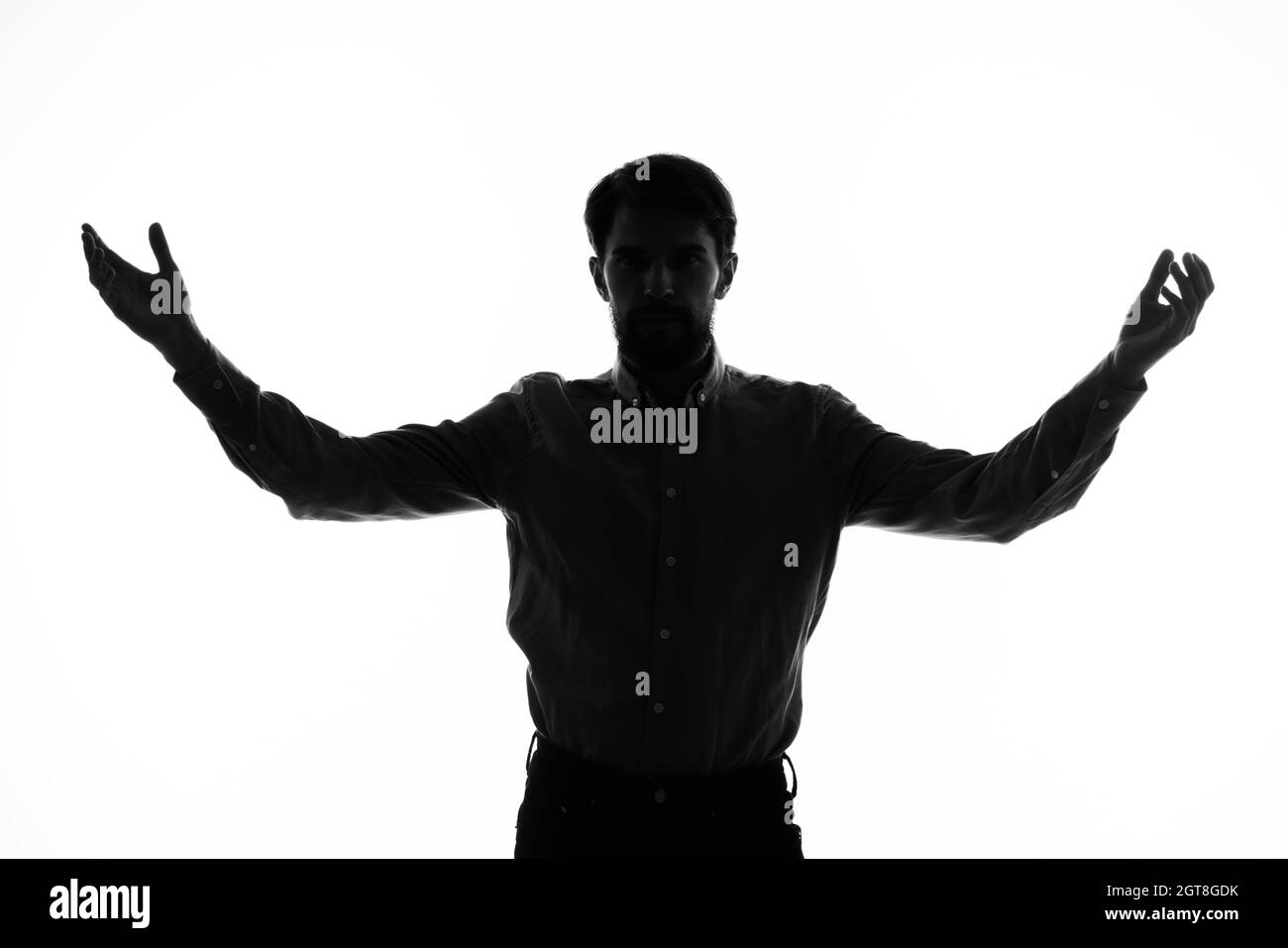 The man in a suit with a pistol in hand crime hand gesture posing ...