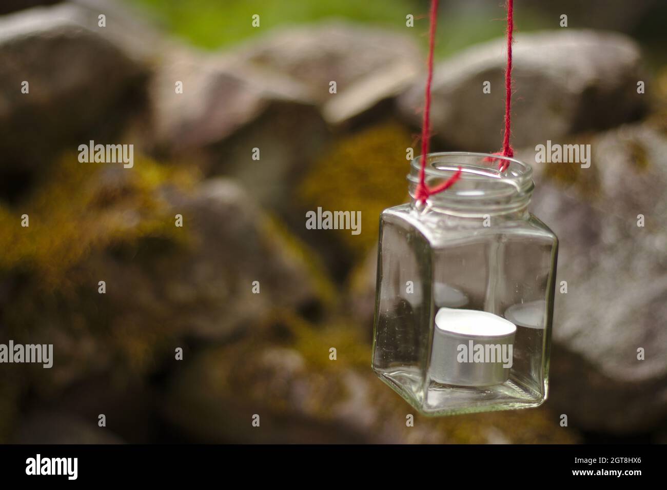 Candle hanging in tree outdoors hi-res stock photography and images - Alamy