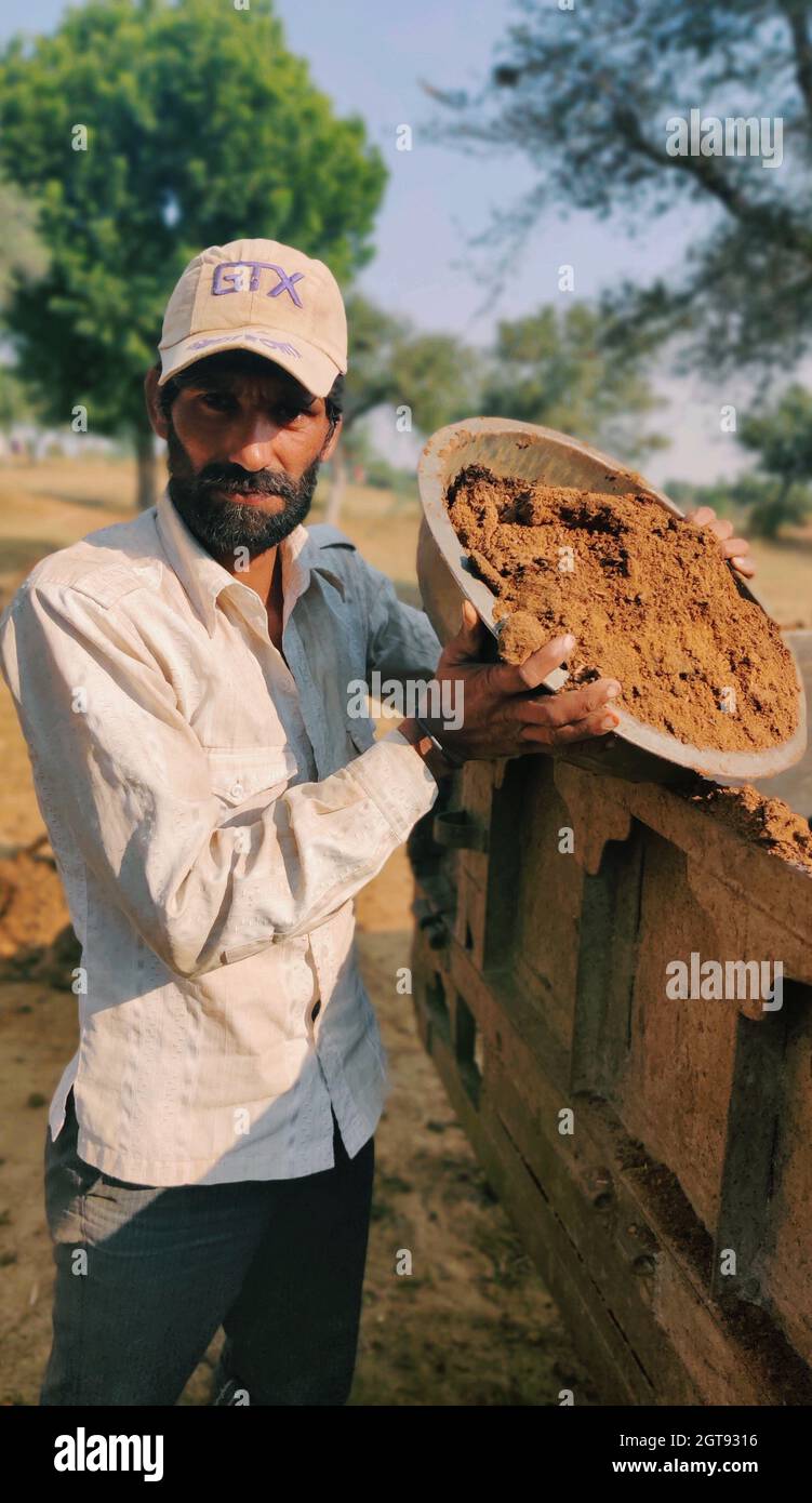 A Man Doing Mud Work Stock Photo - Alamy