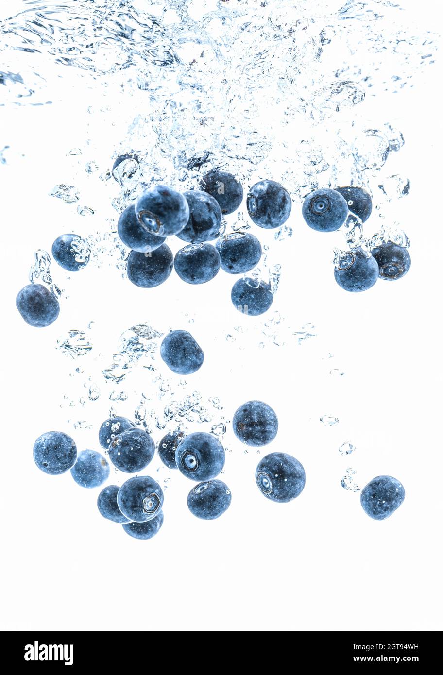 Blueberries Close-up Of Bubbles Over White Background Stock Photo - Alamy