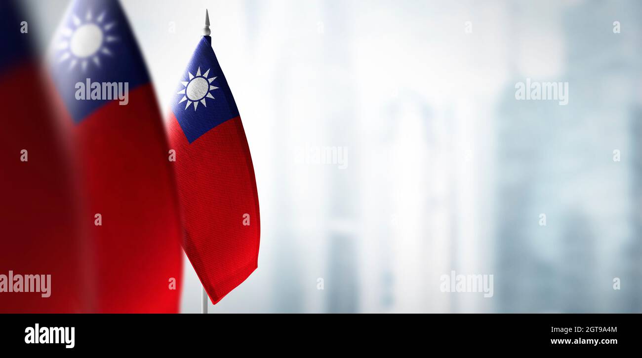 Small flags of Taiwan on a blurry background of the city Stock Photo ...