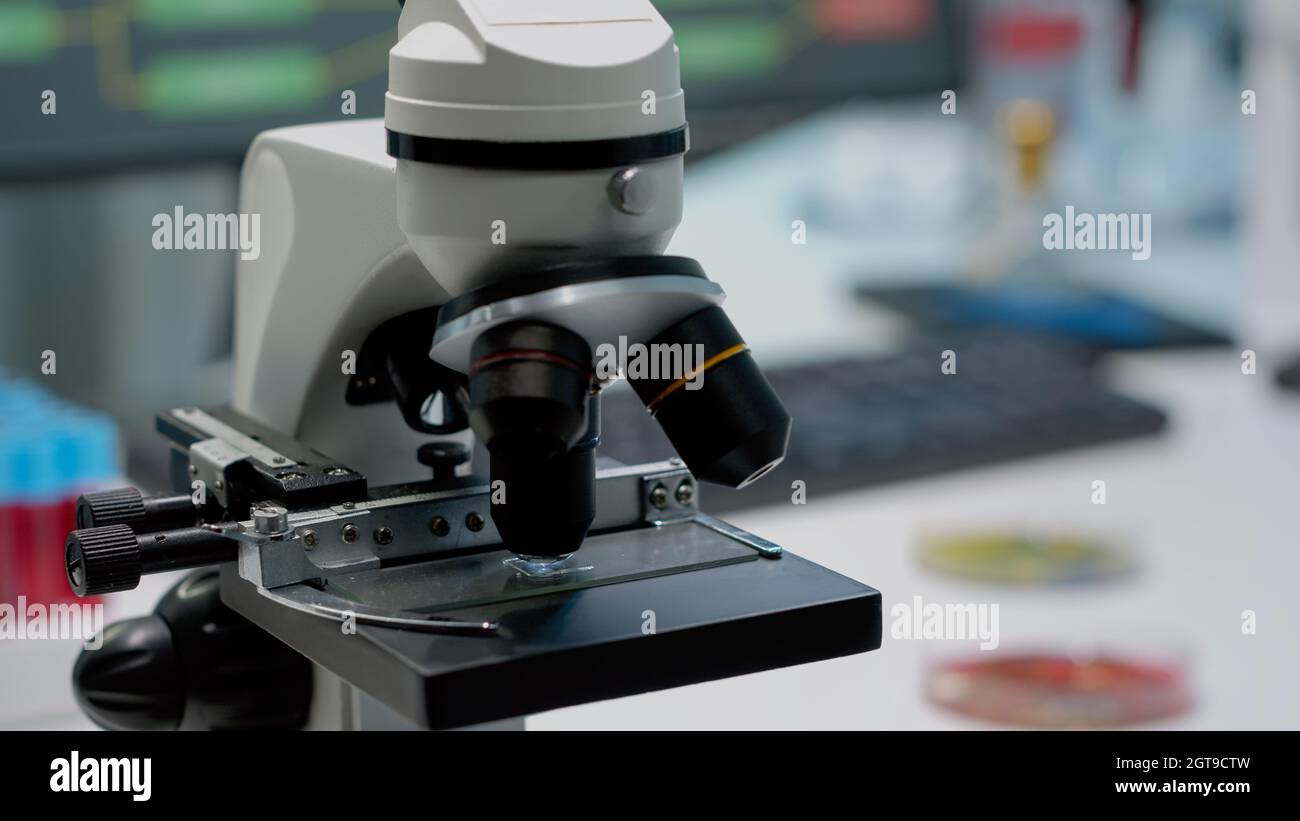 Close up of glass lens microscope on laboratory desk at research clinic ...
