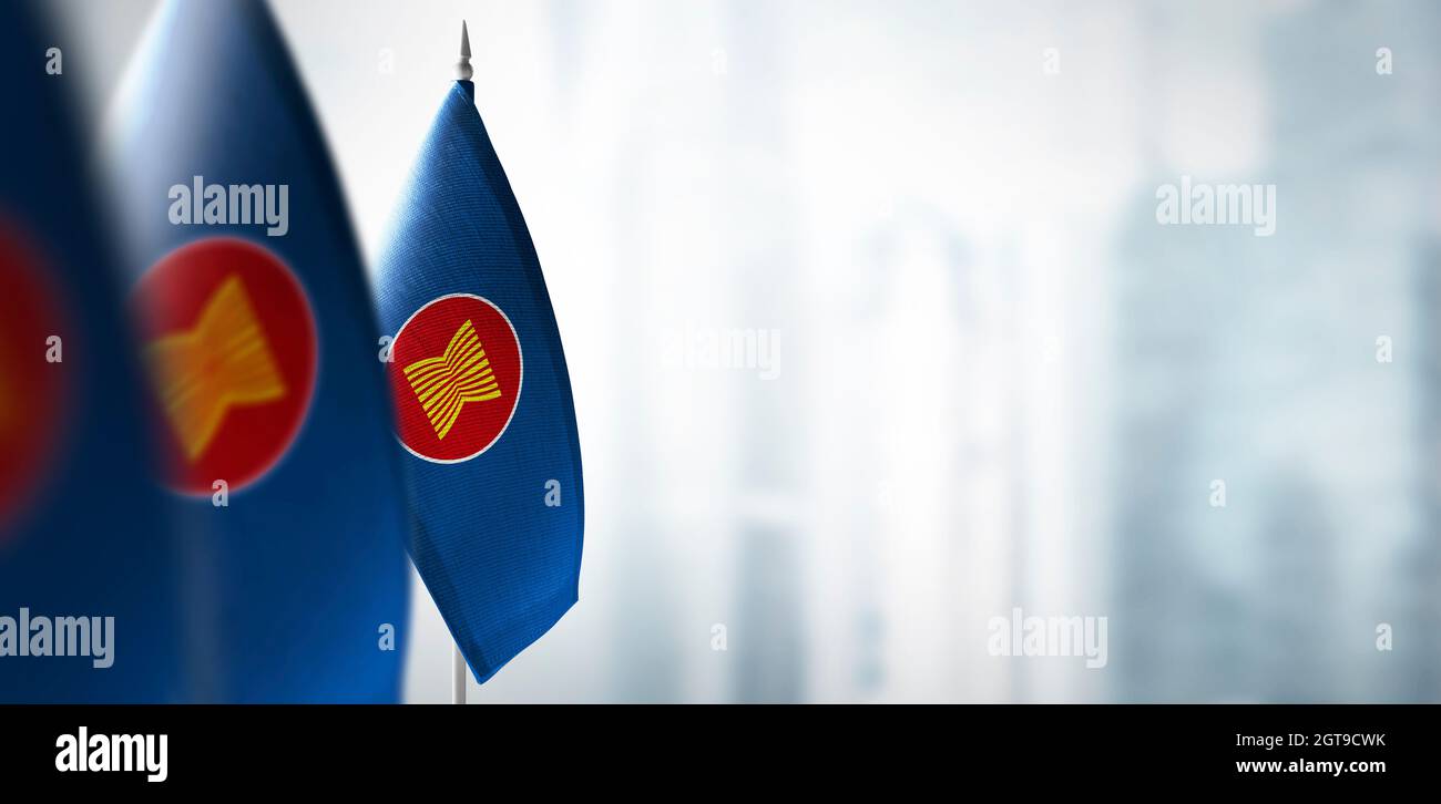 Small flags of ASEAN on a blurry background of the city Stock Photo - Alamy