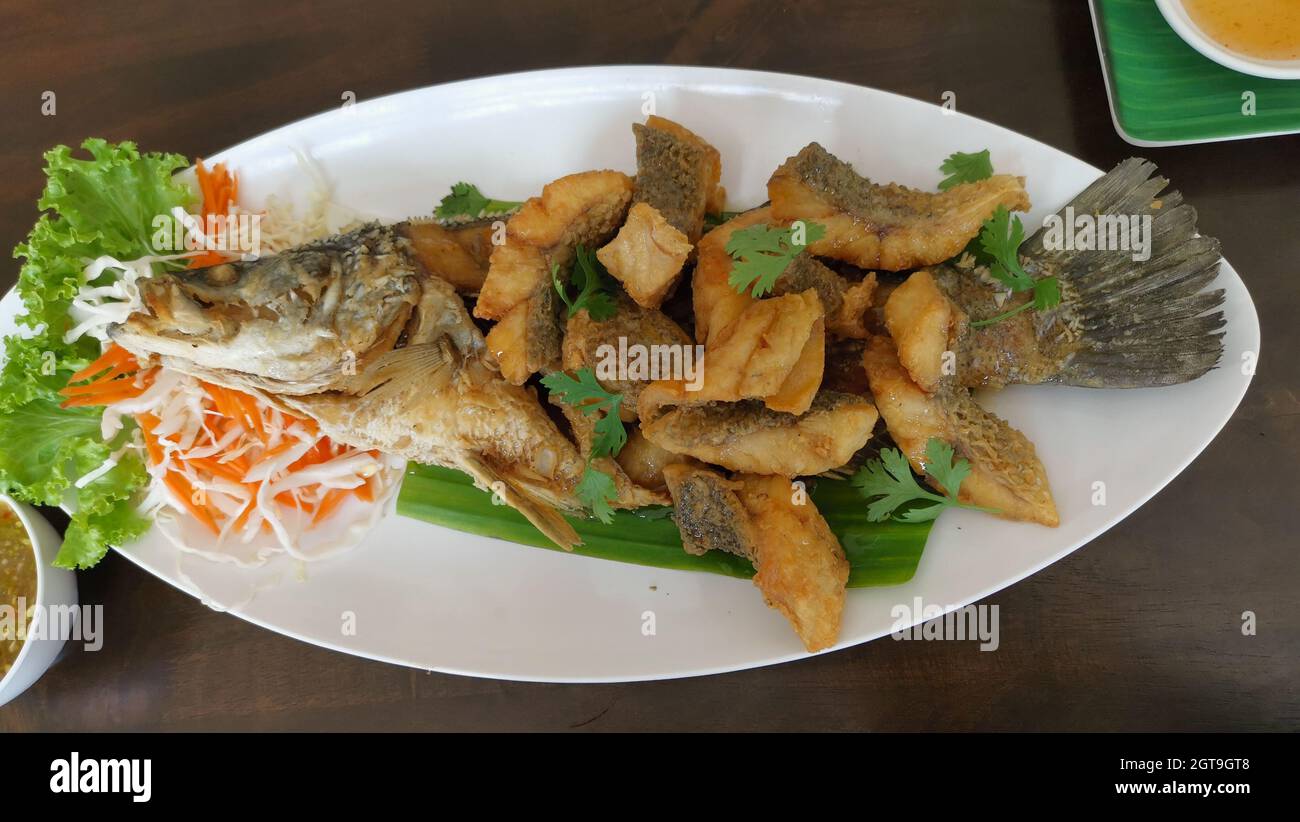 Deep fried sea bass fish hi-res stock photography and images - Alamy