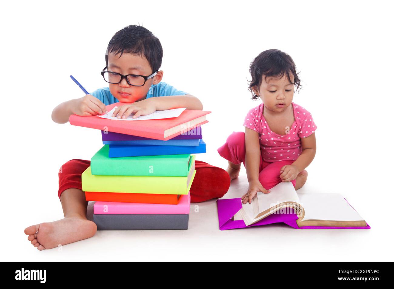 Two boys reading book Cut Out Stock Images & Pictures - Alamy