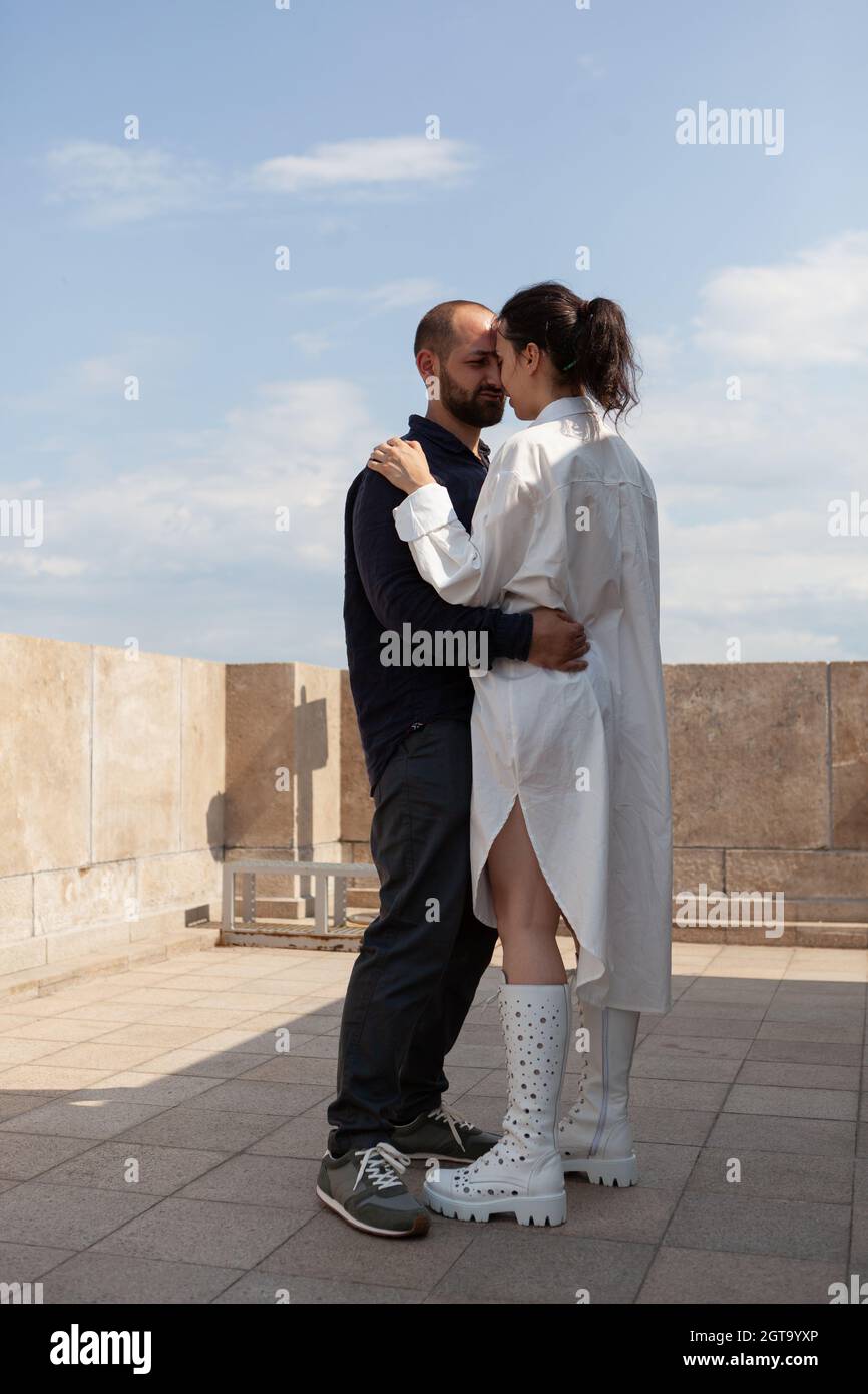 Happy married couple celebrating relationship anniversary standing on ...