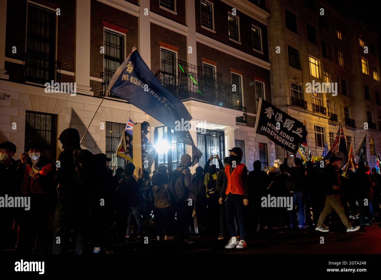 A crowd of protesters holds "Hong Kong Independence" flags during the ...