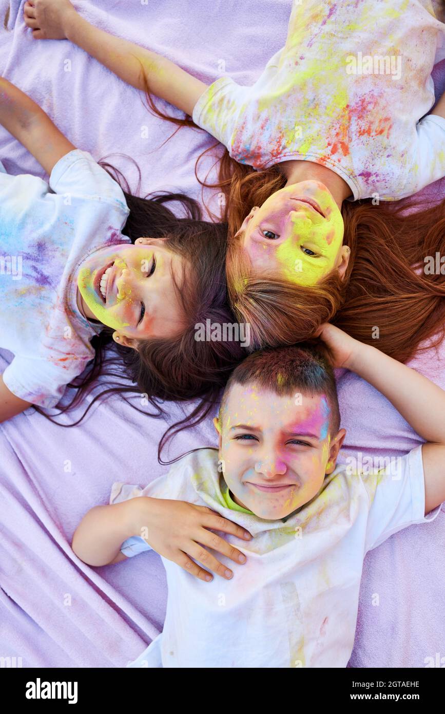 children with colored powder having fun outdoor Stock Photo - Alamy