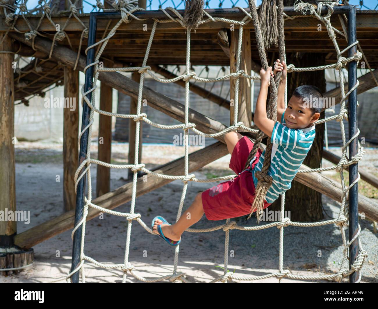Boy climbing ladder asia hi-res stock photography and images - Alamy