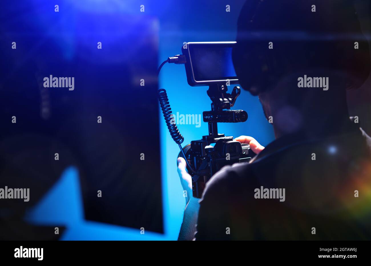 Rear View Of Man Holding Camera Stock Photo - Alamy