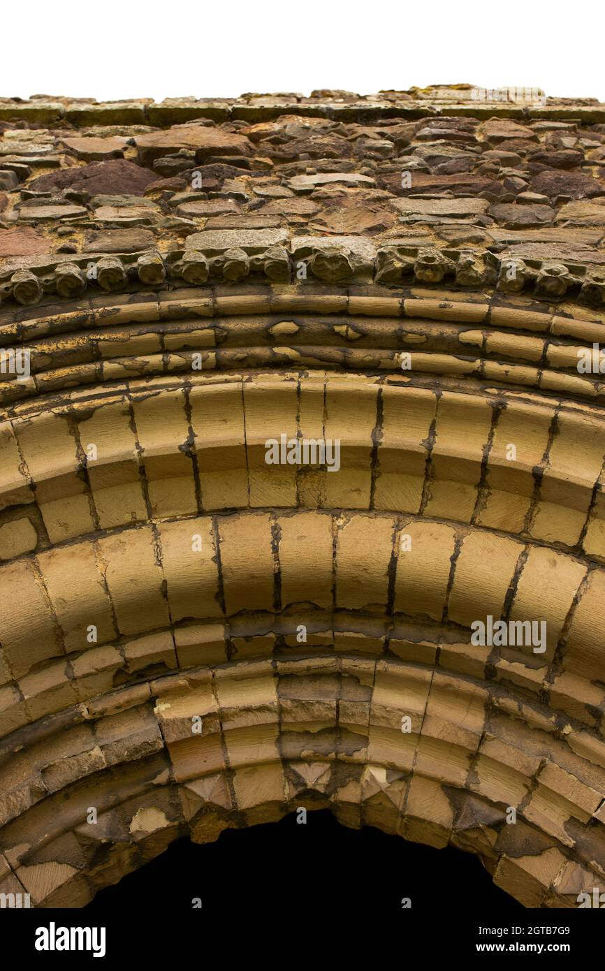Stone arch on an entrance to a medieval abbey ruin. Medieval ...