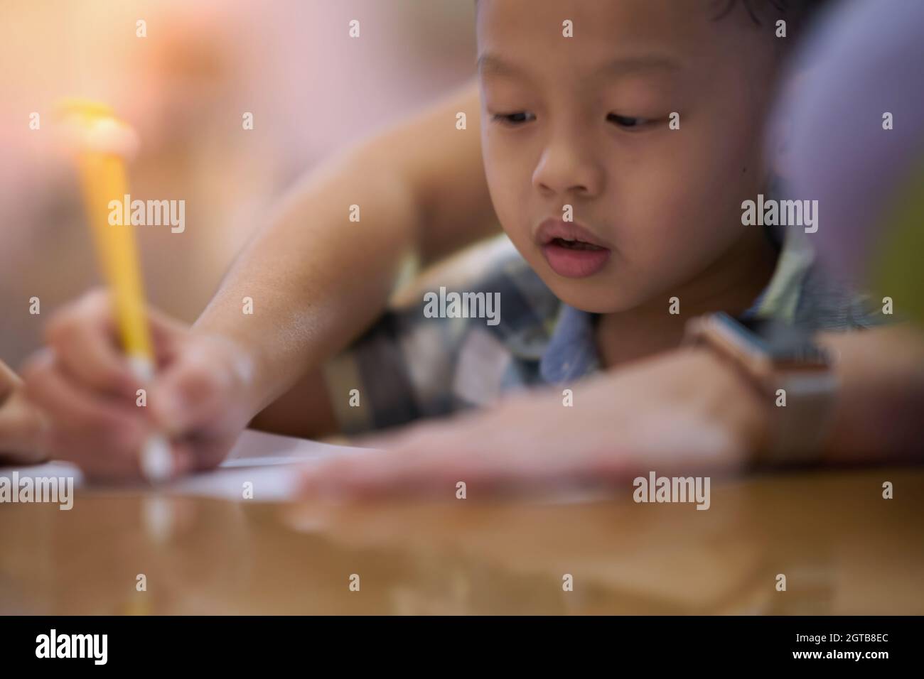 Arab boy writing hi-res stock photography and images - Alamy