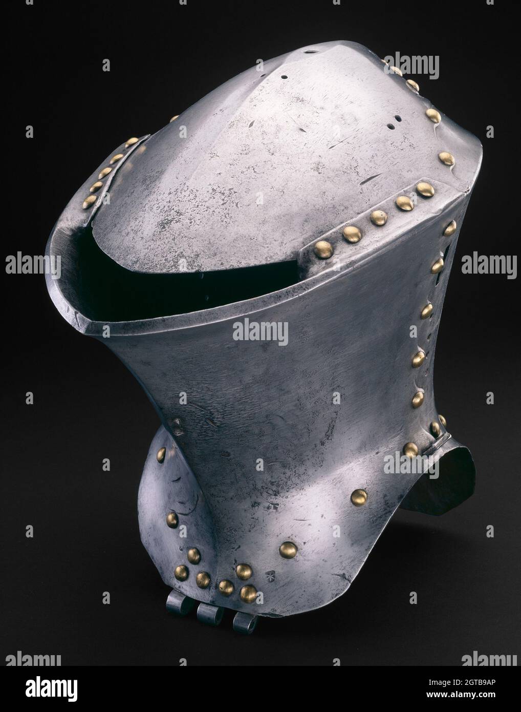 Vertical shot of an old military helmet for head and neck protection on ...