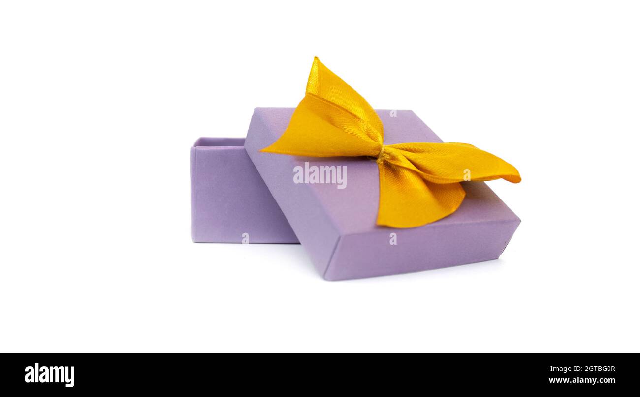 Blank open purple gift box with yellow ribbon bow isolated on white ...