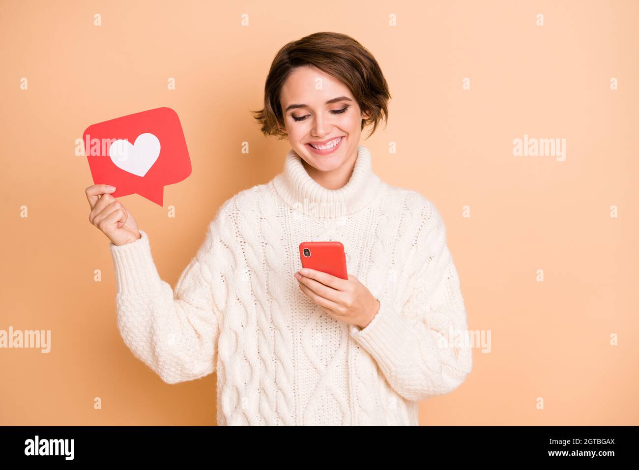 Photo portrait of female student using cellphone showing like icon ...