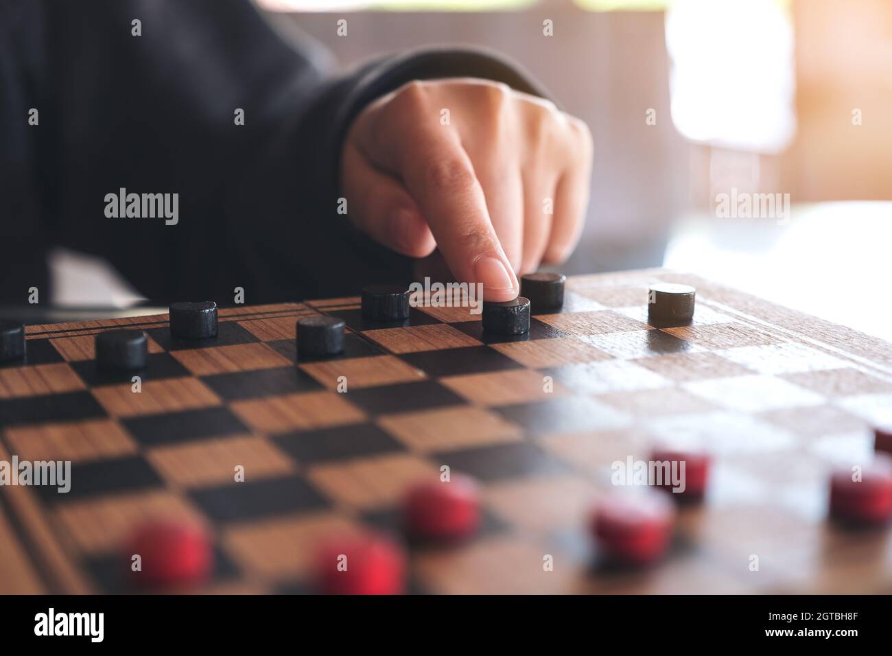 Person playing checkers hi-res stock photography and images - Alamy