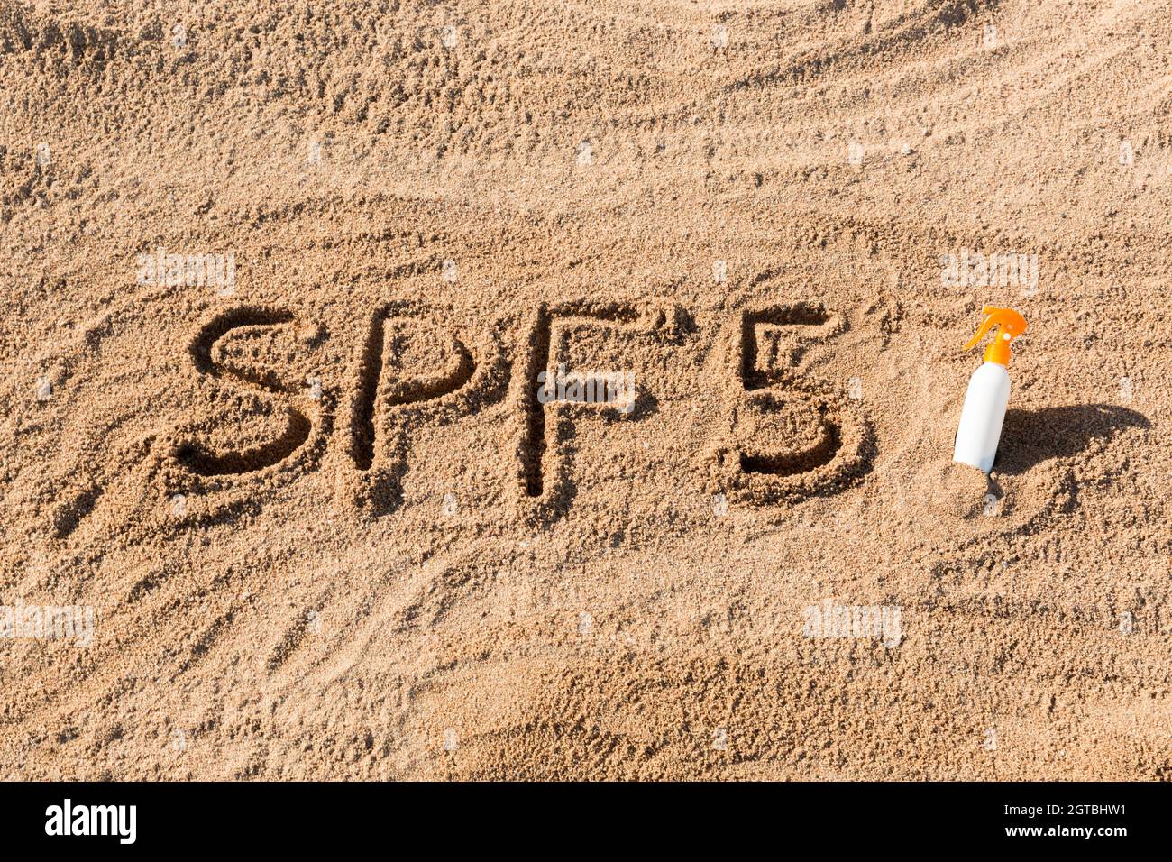 Sun Protect Factor. Spf Word Written On The Sand. Skin Care Concept ...